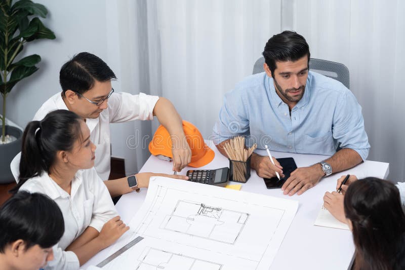 Diverse Group of Civil Engineer and Client Working on Architect ...