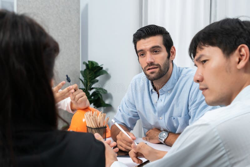 Diverse Group of Civil Engineer and Client Working on Architect ...