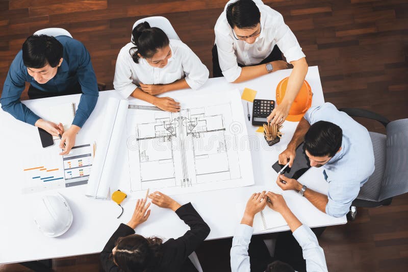 Diverse Group of Civil Engineer and Client Working on Architect ...