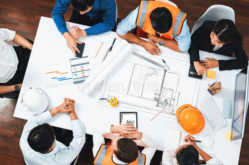 Diverse Group of Civil Engineer and Client Working on Architect ...