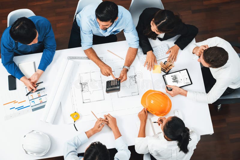 Diverse Group of Civil Engineer and Client Working on Architect ...