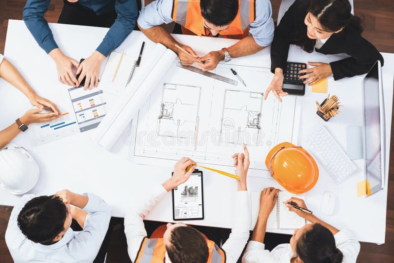 Diverse Group of Civil Engineer and Client Working on Architect ...