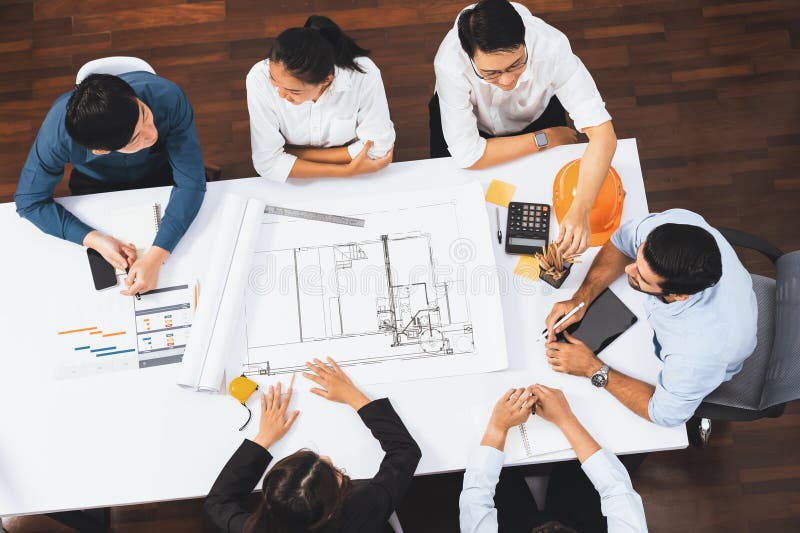 Diverse Group of Civil Engineer and Client Working on Architect ...