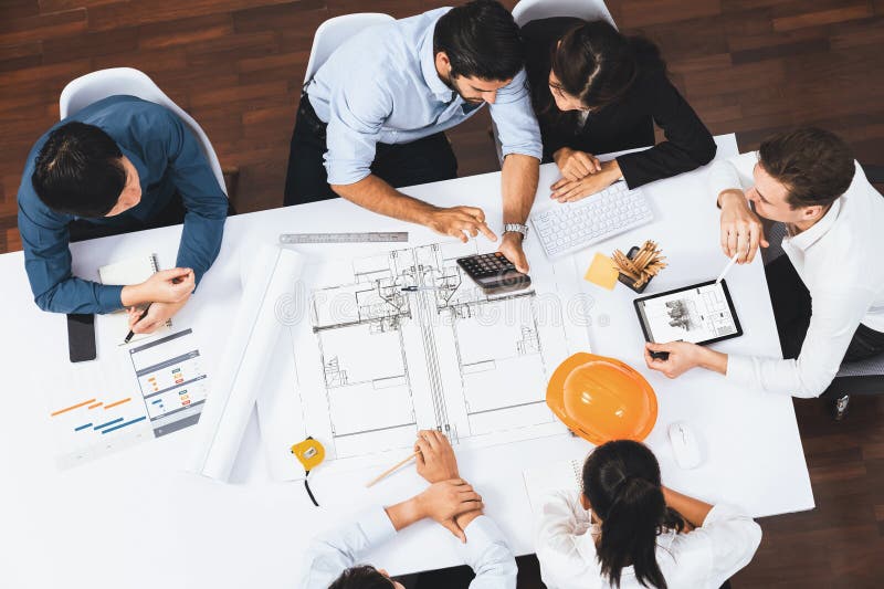 Diverse Group of Civil Engineer and Client Working on Architect ...