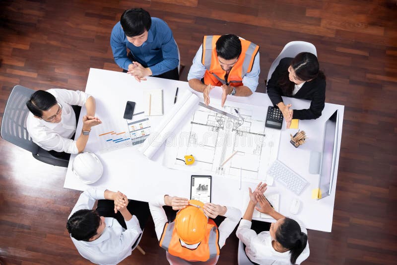 Diverse Group of Civil Engineer and Client Working on Architect ...