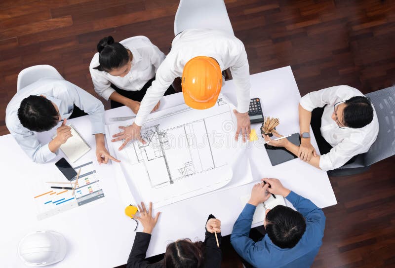 Diverse Group of Civil Engineer and Client Working on Architect ...