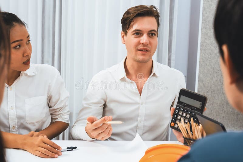 Diverse Group of Civil Engineer and Client Working on Architect ...