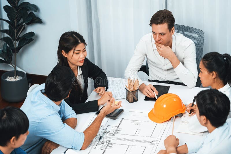 Diverse Group of Civil Engineer and Client Working on Architect ...