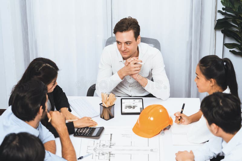 Diverse Group of Civil Engineer and Client Working on Architect ...