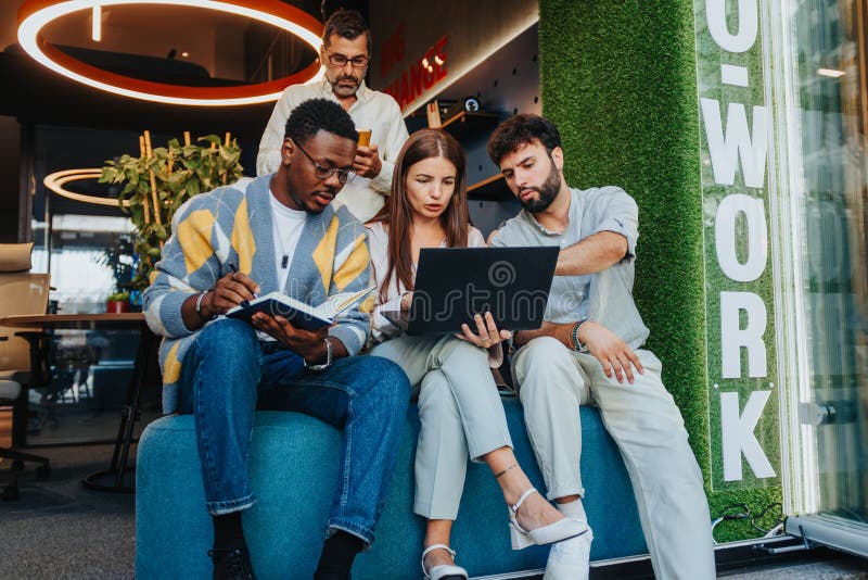 Diverse Group of Colleagues Collaborating in a Creative Co-Working ...