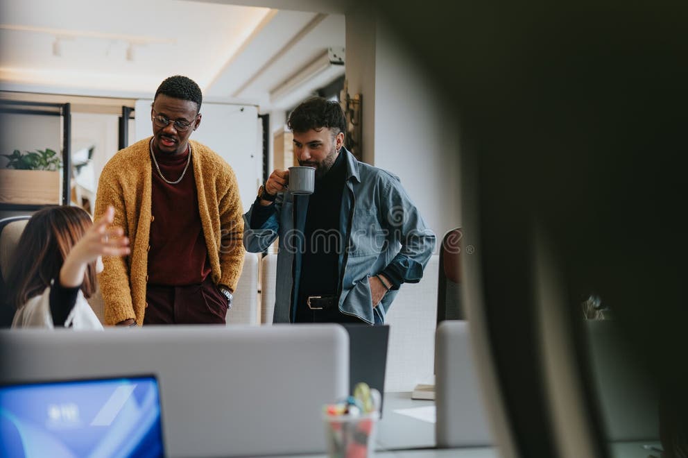 Diverse Group of Colleagues Discussing Reports, Analyzing Statistics ...