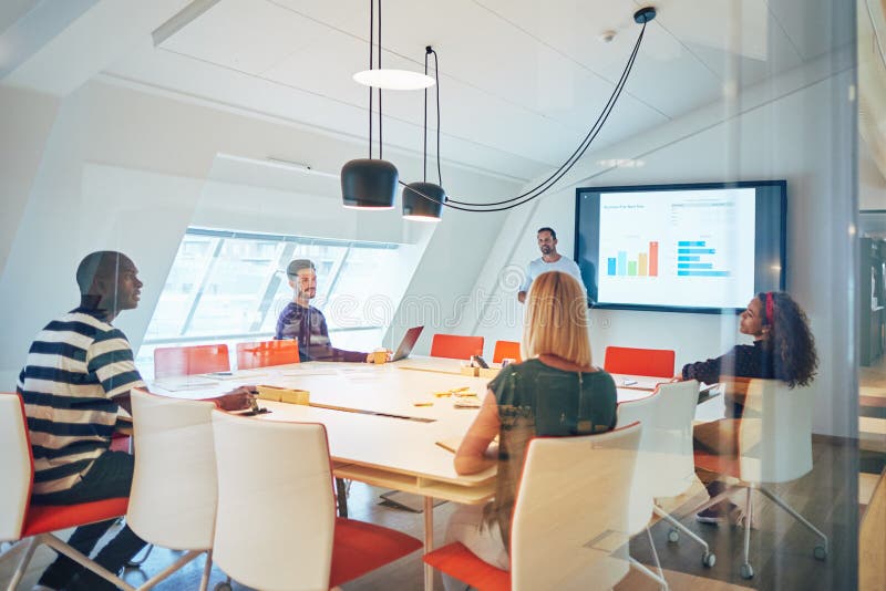 Diverse Group of Colleagues Talking Together during an Office Pr Stock ...