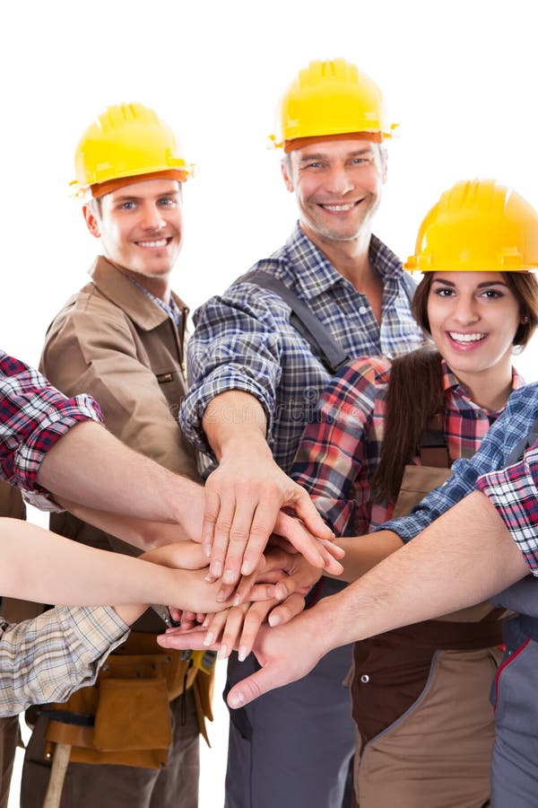 Diverse Group of Construction Workers Collaborate on a Construction ...
