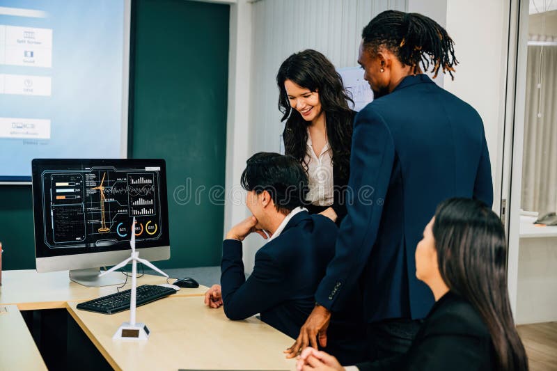 A Diverse Group of Coworkers Meeting Around a Desktop Computer ...