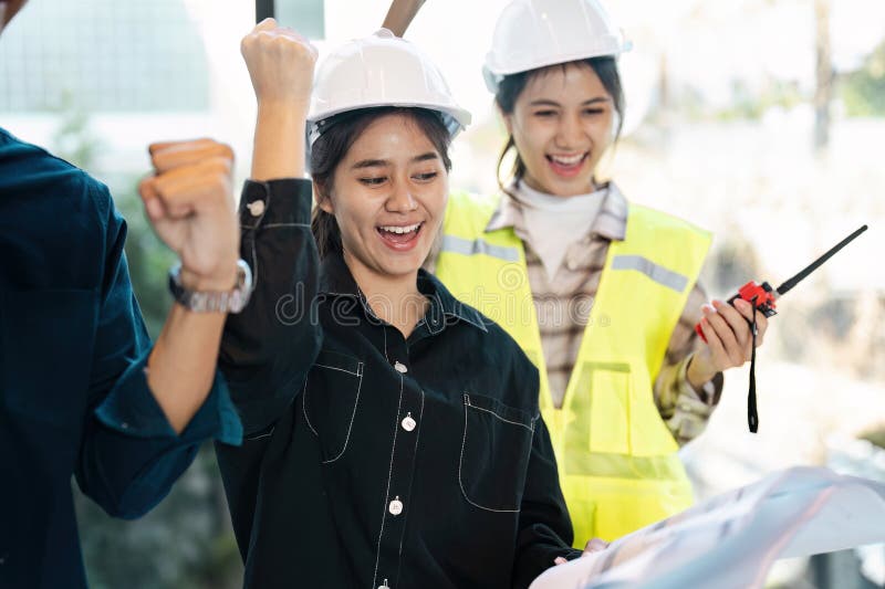Diverse Group of Engineers Celebrating Success at Construction Site ...
