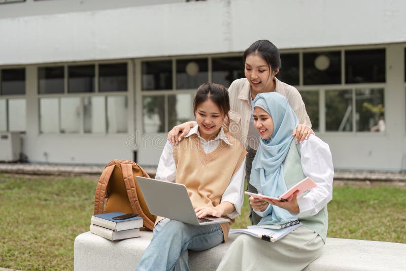 Diverse Female Students Studying Together with a Laptop and Books at ...