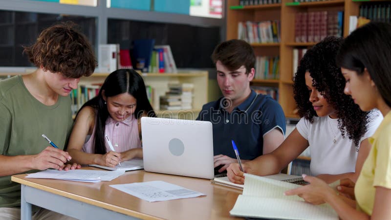Diverse Group of Five High School Students Working Together at Library ...
