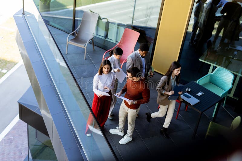 Team Brainstorming and Collaboration on a Terrace during a Sunny ...