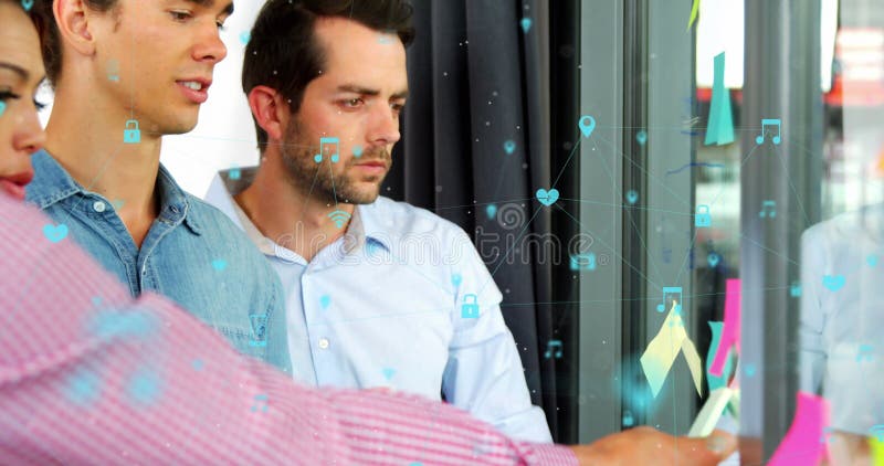 Diverse Group of Friends Analyzing Data on Glass Wall Stock Photo ...