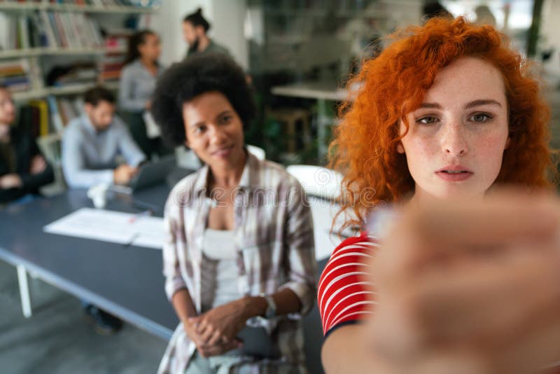 Diverse Group of Happy Employees Analyzing Reports with Digital Device ... Diverse Group of Happy Employees Analyzing Reports with Digital Device ...
