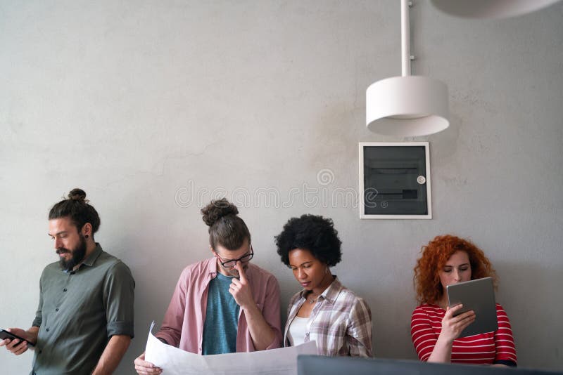 Diverse Group of Happy Employees Analyzing Reports with Digital Device ... Diverse Group of Happy Employees Analyzing Reports with Digital Device ...
