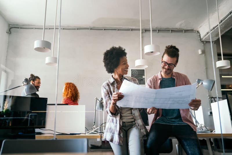 Diverse Group Happy Employees Analyzing Reports Together Papers Working ...