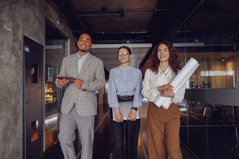 A Diverse Team Engaged in Collaborative Work within a Modern Office ...