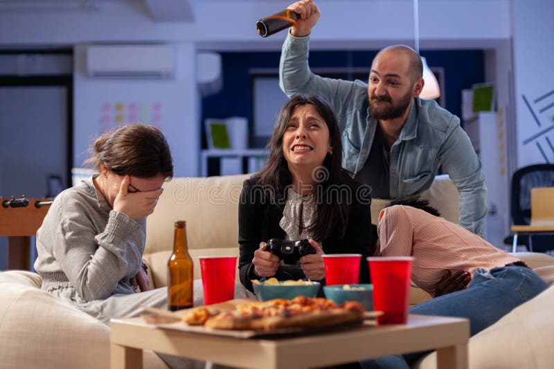 Diverse Group of Mates Bonding while Playing Video Game Stock Photo ...