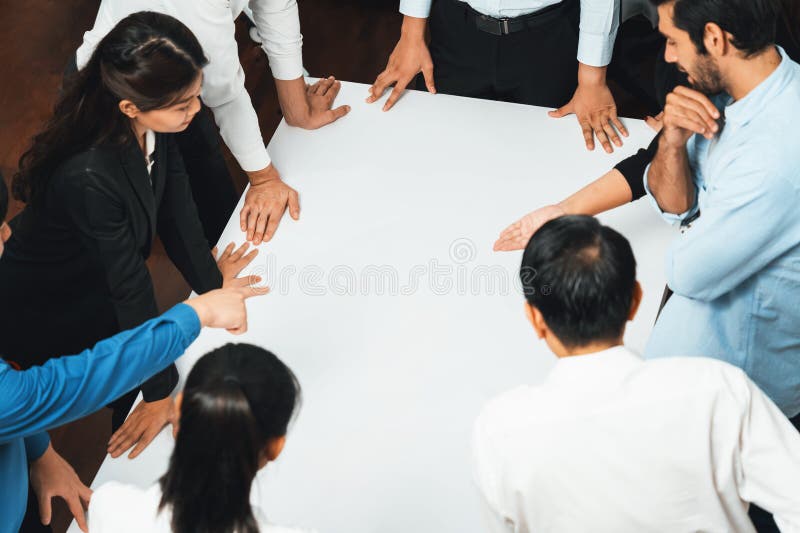 Businesspeople on Meeting Table Pointing To Empty Space. Prudent Stock ...