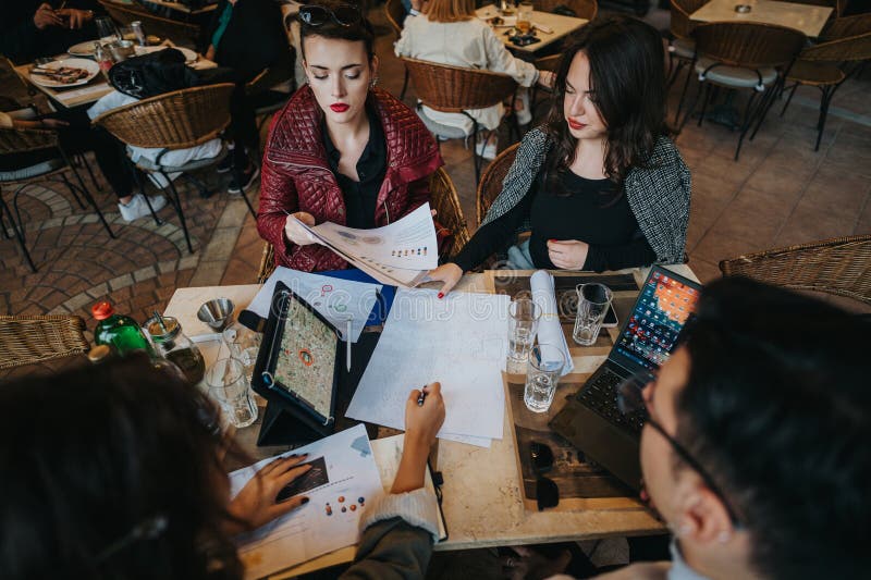 Multicultural Business Team Collaborating in a Coffee Shop Meeting ...