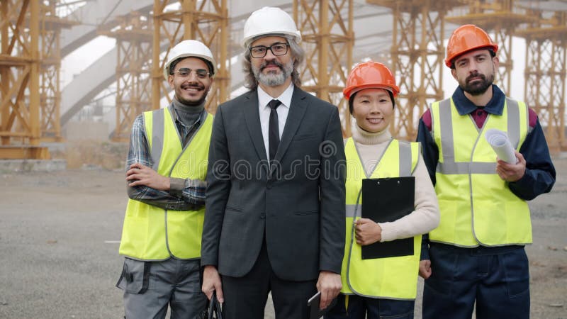 Diverse Group of People Building Team Standing Outdoors in Construction ...