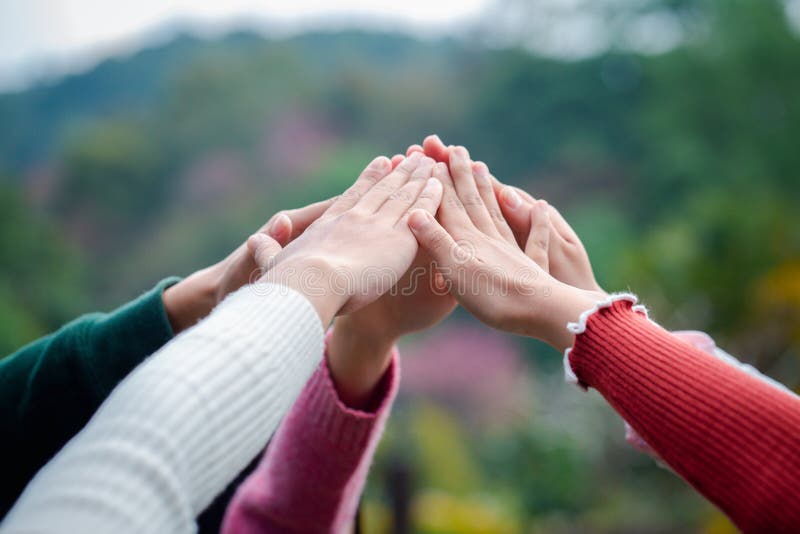 A Diverse Group of People Connects Their Hands As a Supportive Sign ...