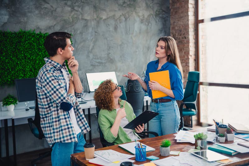 Young Professionals Collaborating in a Modern Office Workspace ...