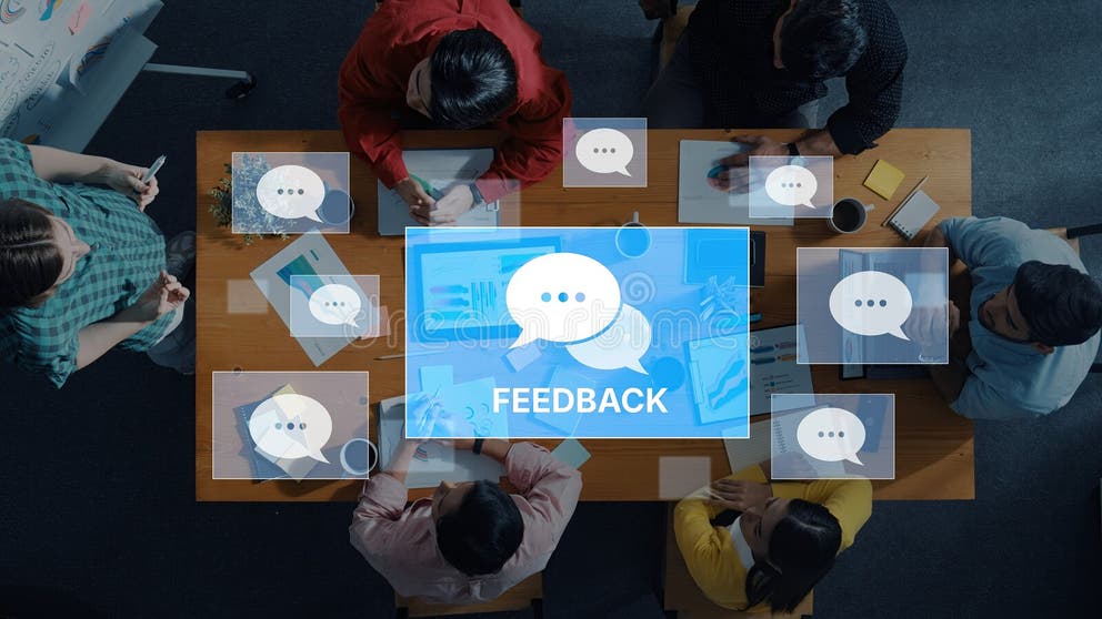 Diverse Group of People Engaged in a Collaborative Feedback Session at a Modern Workspace with ...