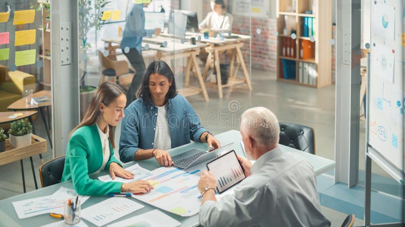 Diverse Group of People Talking in a Casual Modern Meeting Room in ...