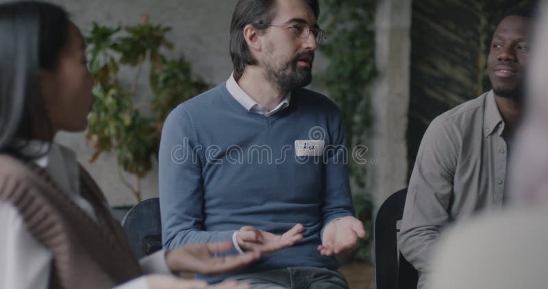 Diverse Group of People Holding Hands Sitting in Circle Enjoying ...
