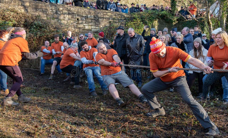 Diverse Group of People Working Together To Pull a Rope during a Game ... Diverse Group of People Working Together To Pull a Rope during a Game ...