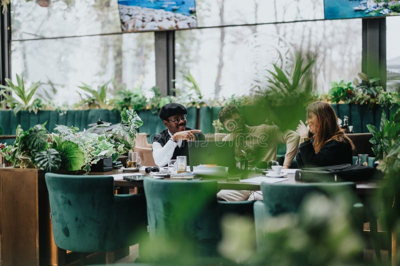 Multiracial Business Colleagues Working Together in a Casual Cafe ...