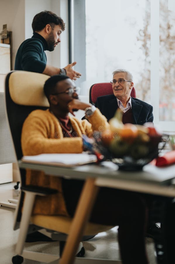 Multicultural Team in Casual Business Meeting with Senior Leader Stock ...