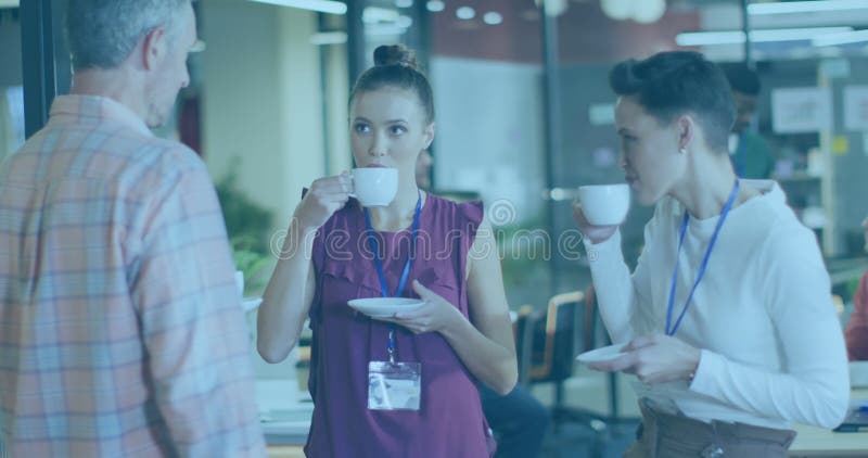 A Diverse Group of Professionals and Intern Having Coffee Break in a ...