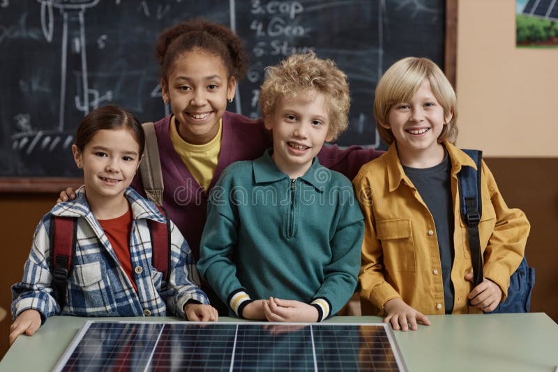 Diverse Group of School Children Looking at Camera in Class Stock Photo ...