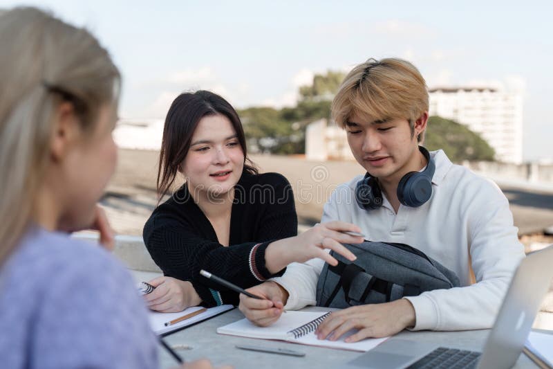 Diverse Group of Students Engaging in Online Learning Together Outdoors ...