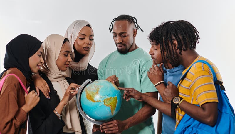 A Diverse Group of Students is Gathered Around a Globe, Engrossed in ...