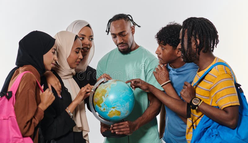 A Diverse Group of Students is Gathered Around a Globe, Engrossed in ...