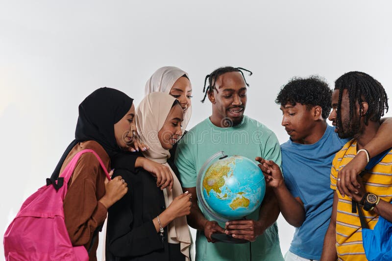 A Diverse Group of Students is Gathered Around a Globe, Engrossed in ...