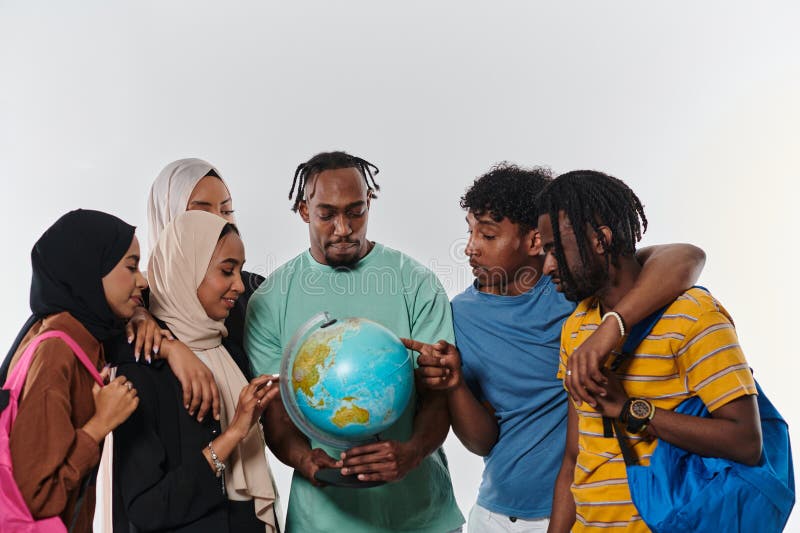 A Diverse Group of Students is Gathered Around a Globe, Engrossed in ...
