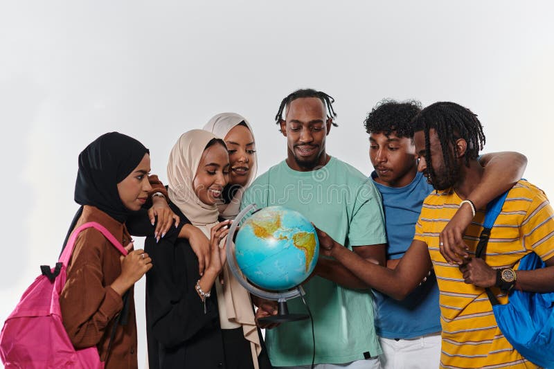 A Diverse Group of Students is Gathered Around a Globe, Engrossed in ...