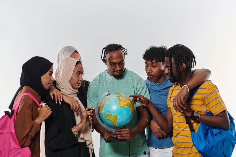 A Diverse Group of Students is Gathered Around a Globe, Engrossed in ...