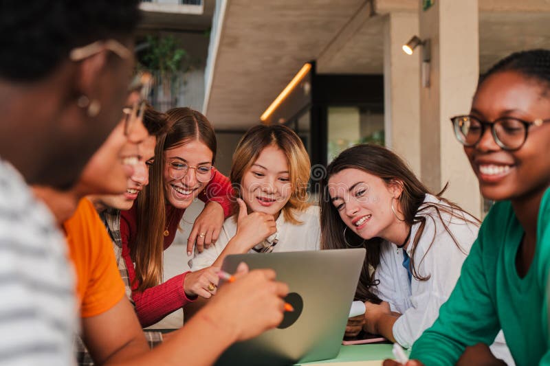 Diverse Group of Teenage Students Studying Together in a Library ...