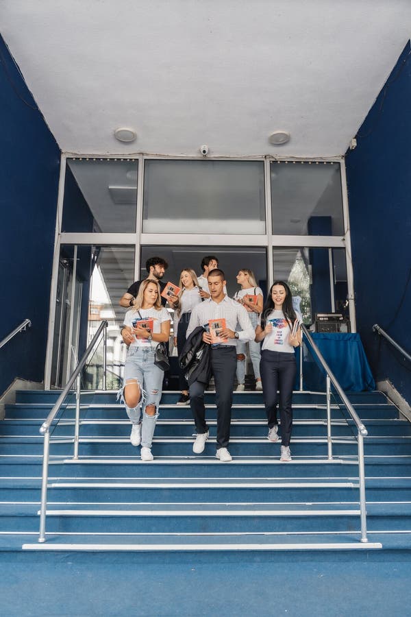 A Diverse Group of University Students Collaborating, Discussing, and ...